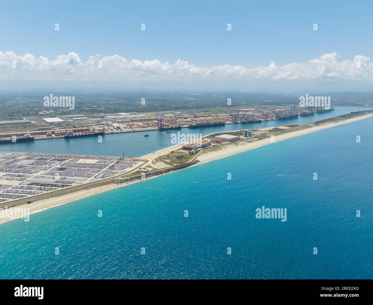 Commercial seaport with cargo ship Stock Photo - Alamy