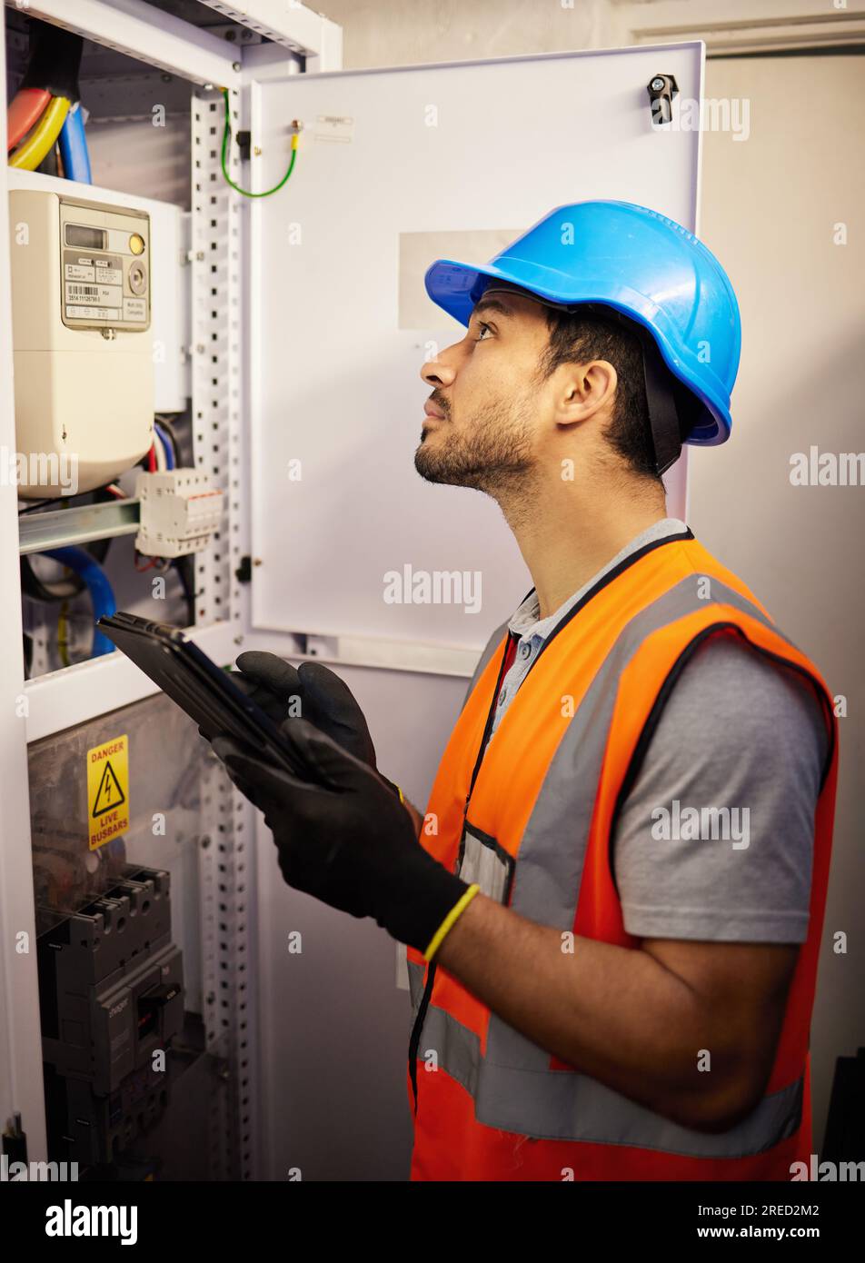 Tablet, electricity and man with control box for repair, maintenance ...