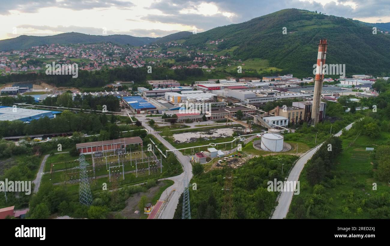 Aerial view of big factory chimney along Stock Photo - Alamy