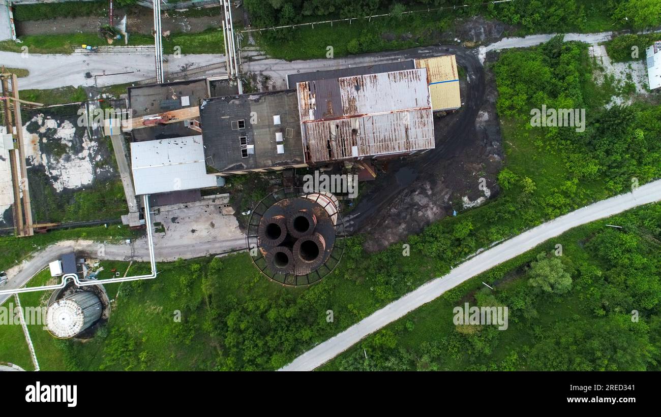 Aerial view of big factory chimney along Stock Photo - Alamy