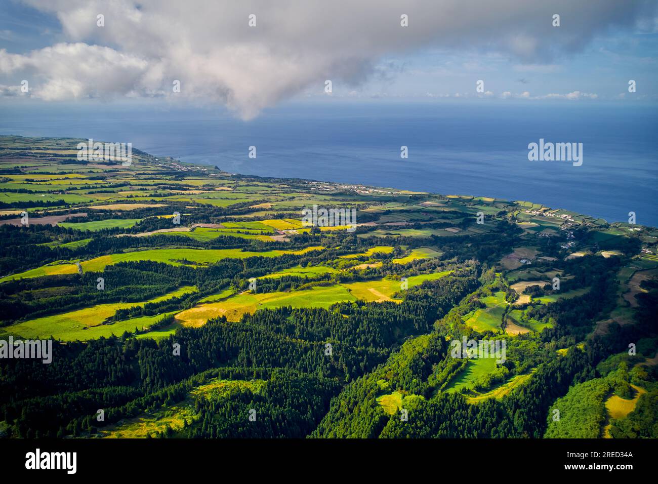 Aerial shot, picturesque nature view of Azores with green hills and ...