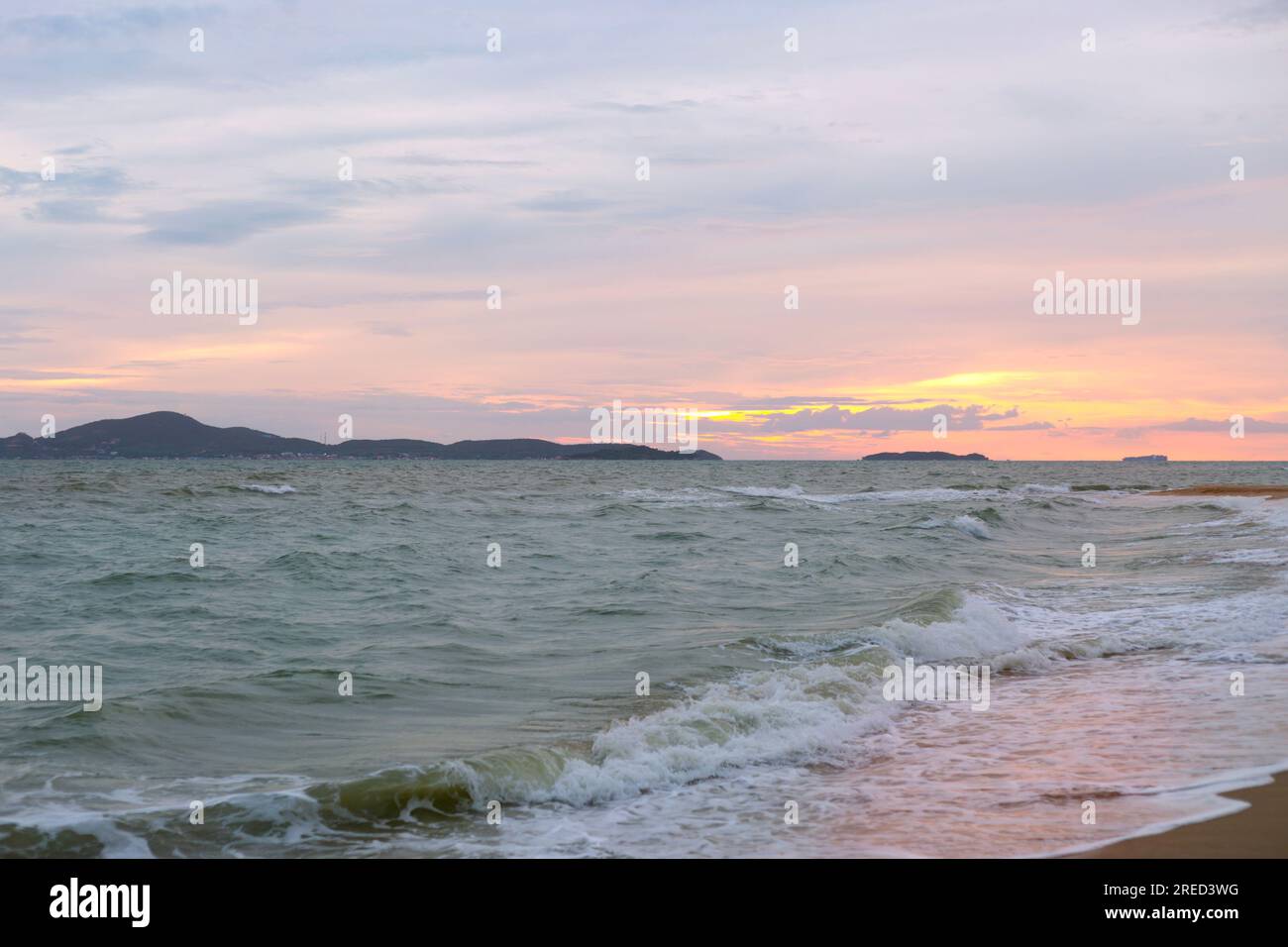 Raging Sea with Sunset Sky Background Stock Photo - Alamy