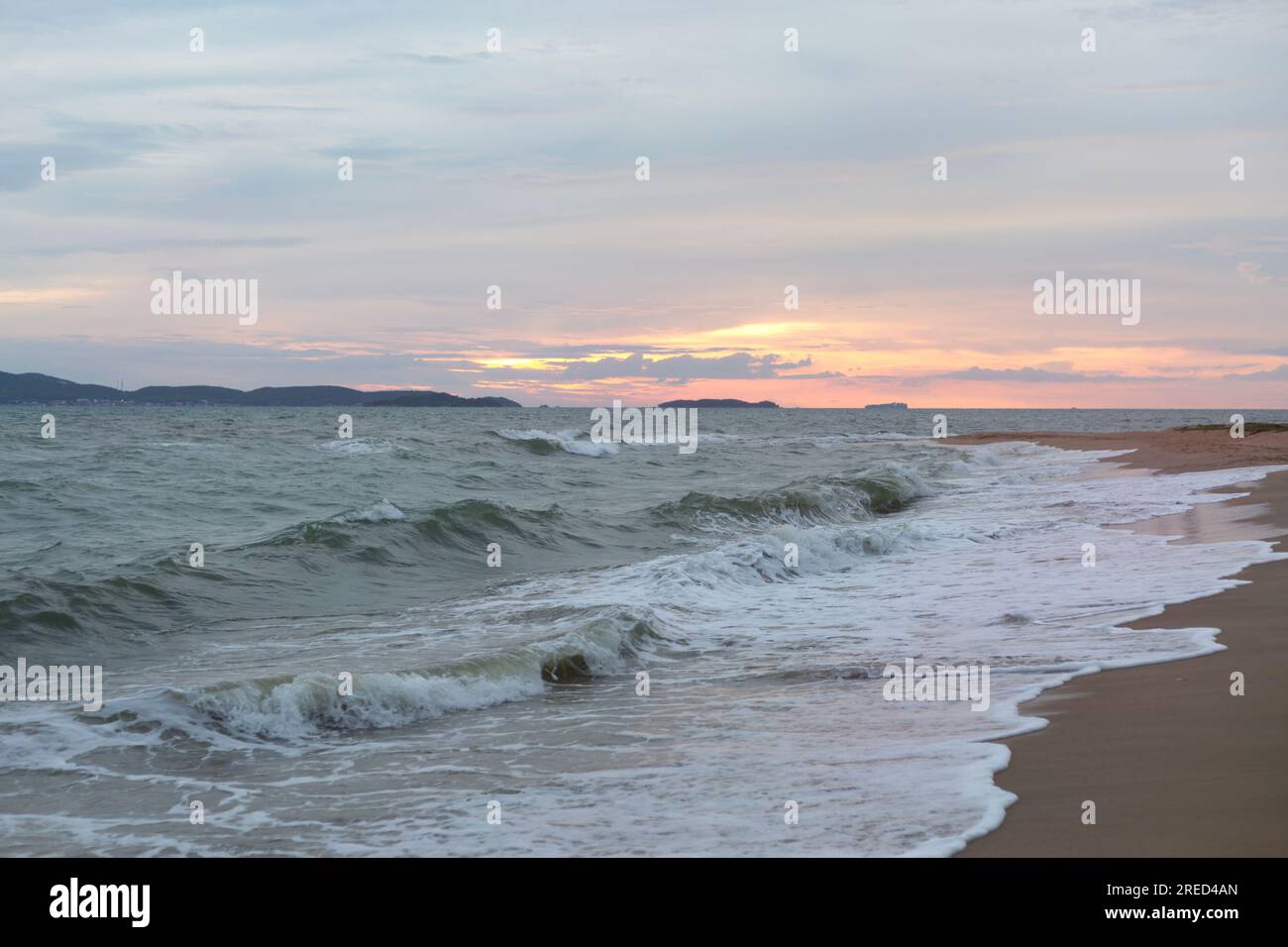 Raging Sea with Sunset Sky Background Stock Photo - Alamy