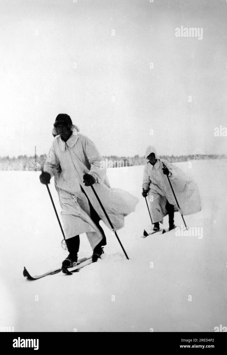 German soldiers in snow shirts and on skis on patrol near Okowtzy ...