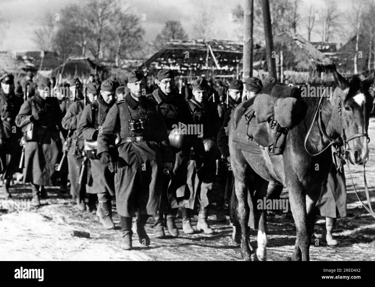 An infantry battalion marches to the rear from the front line. Photo ...