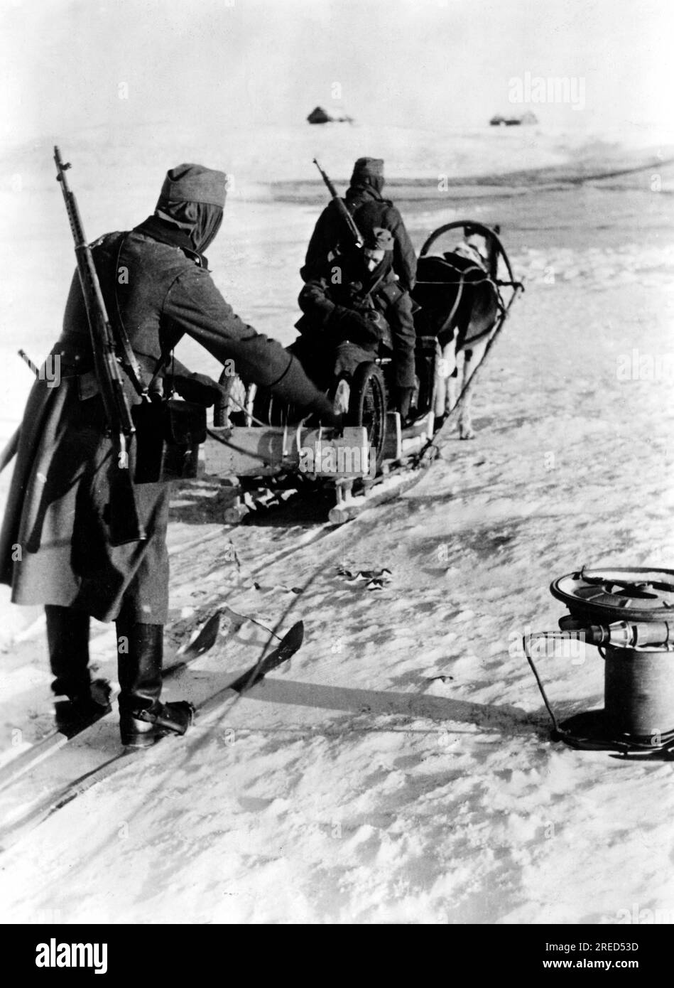 German signalmen with a cable drum mounted on a Panjeschlitten near ...