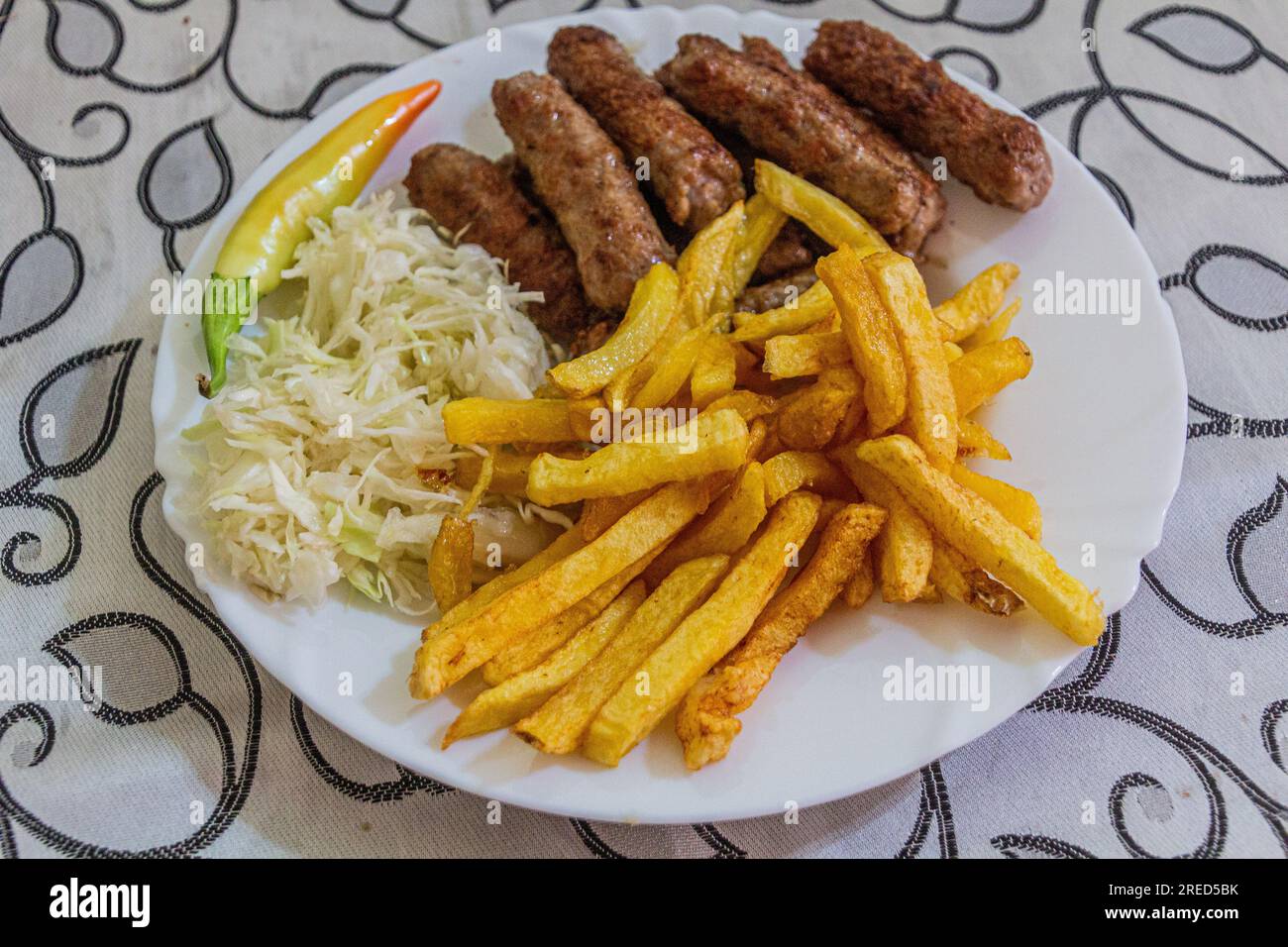 Meal in North Macedonia - cevapi with fries Stock Photo - Alamy