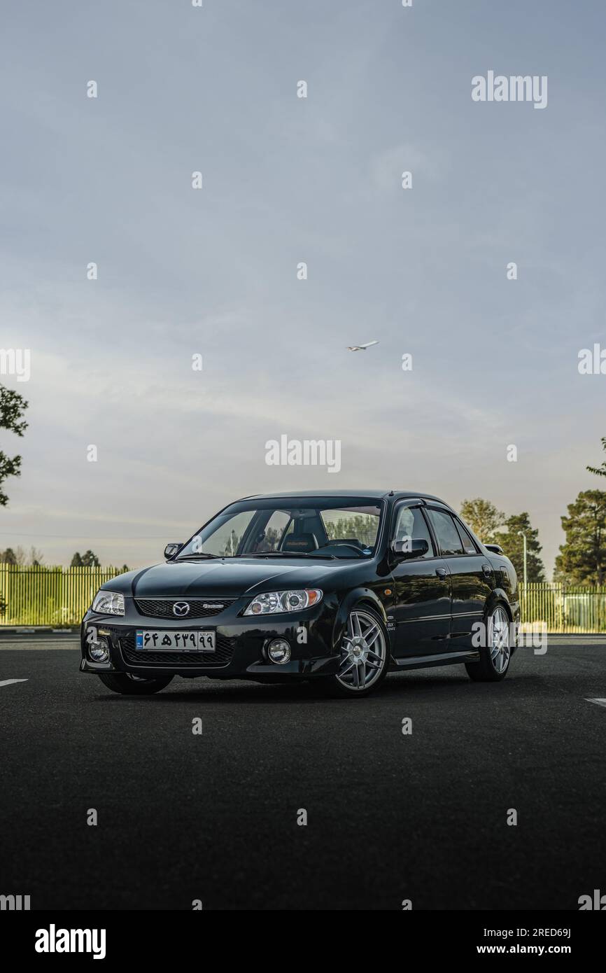 black mazda 323 speed protege Stock Photo - Alamy