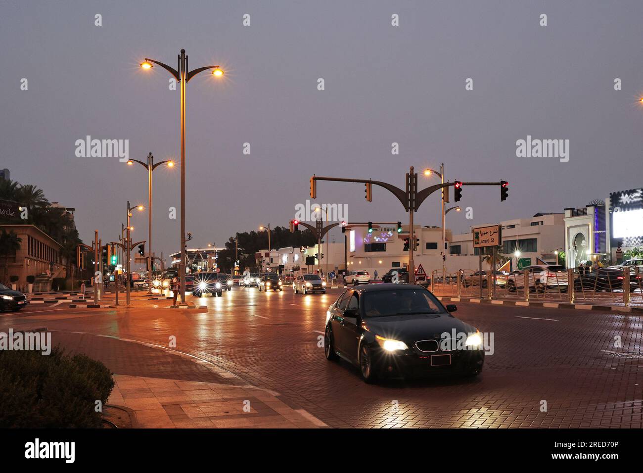 Car traffic at night in the city center. Lanterns with night ...