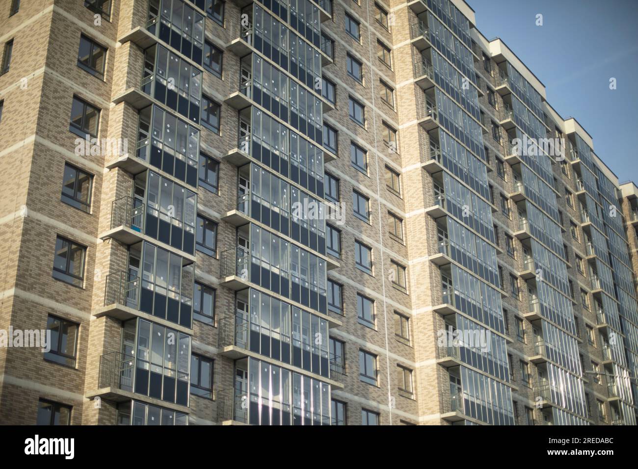 Windows in new building. Apartment building in city. New housing ...