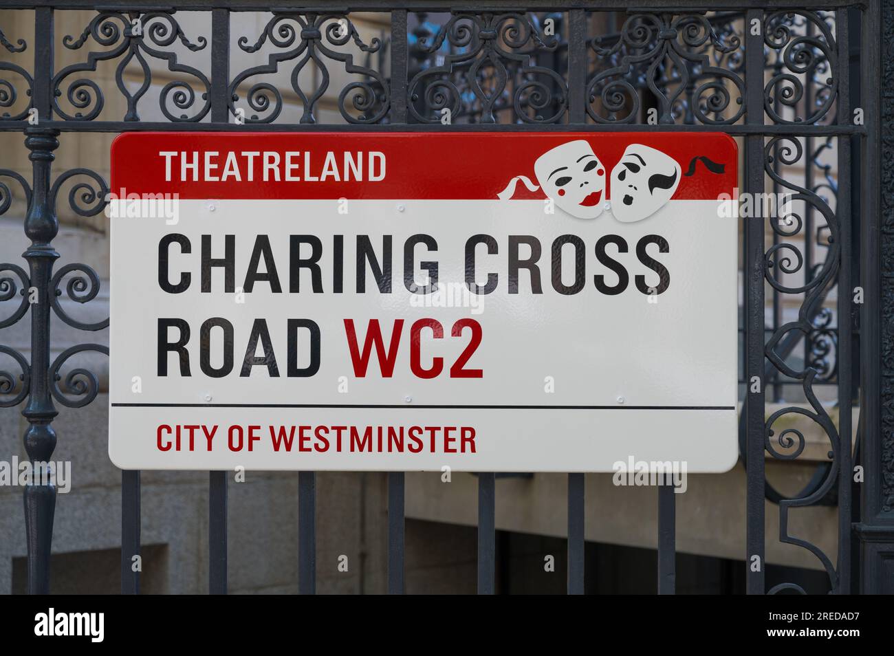 Road name sign for Charing Cross Road fixed on iron railings. London ...