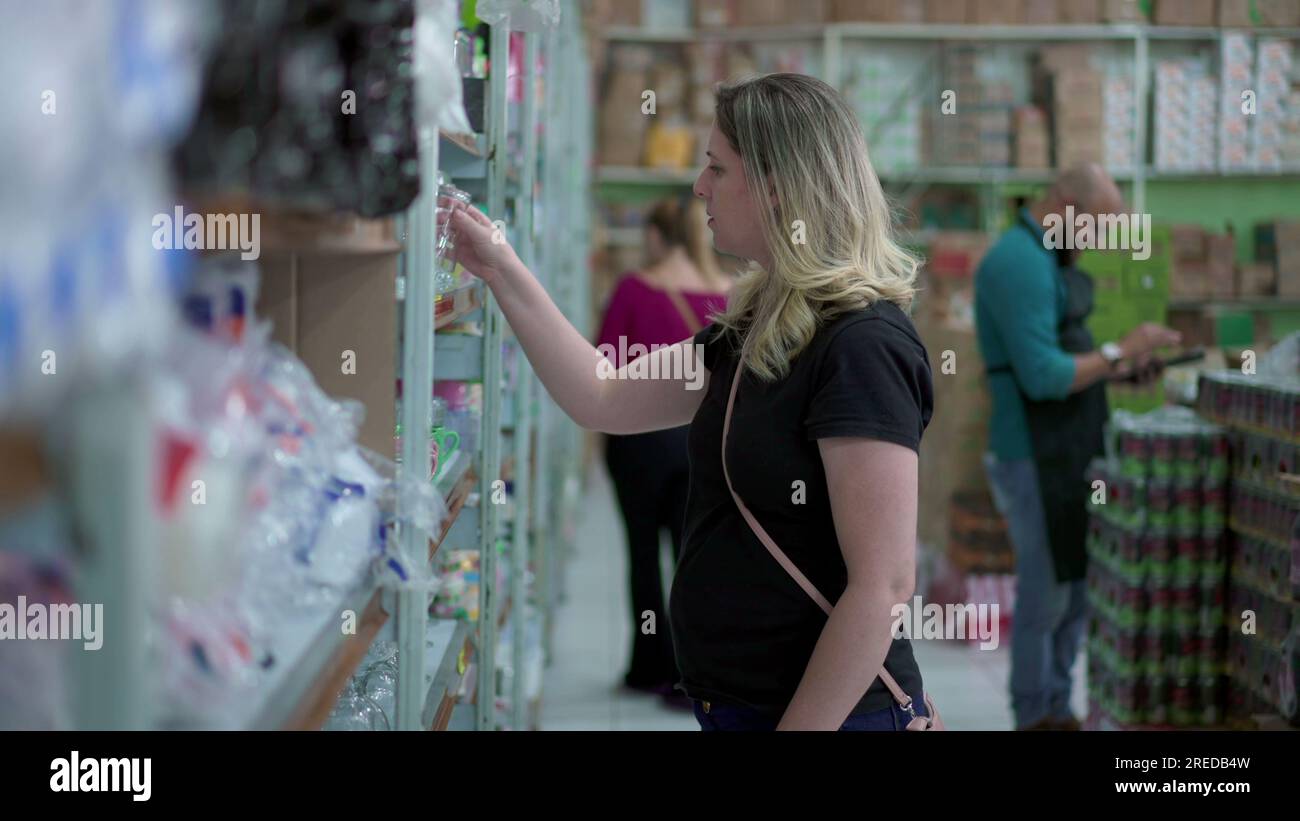 Woman Browsing Products at Grocery Store Depicting Consumer Lifestyle ...