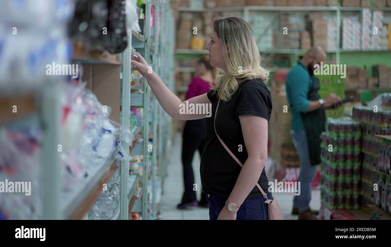 Woman Browsing Products at Grocery Store Depicting Consumer Lifestyle ...