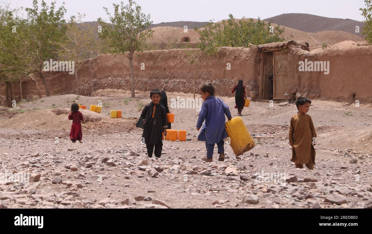 Farah, Afghanistan. 26th July, 2023. Children carry water amid hot ...