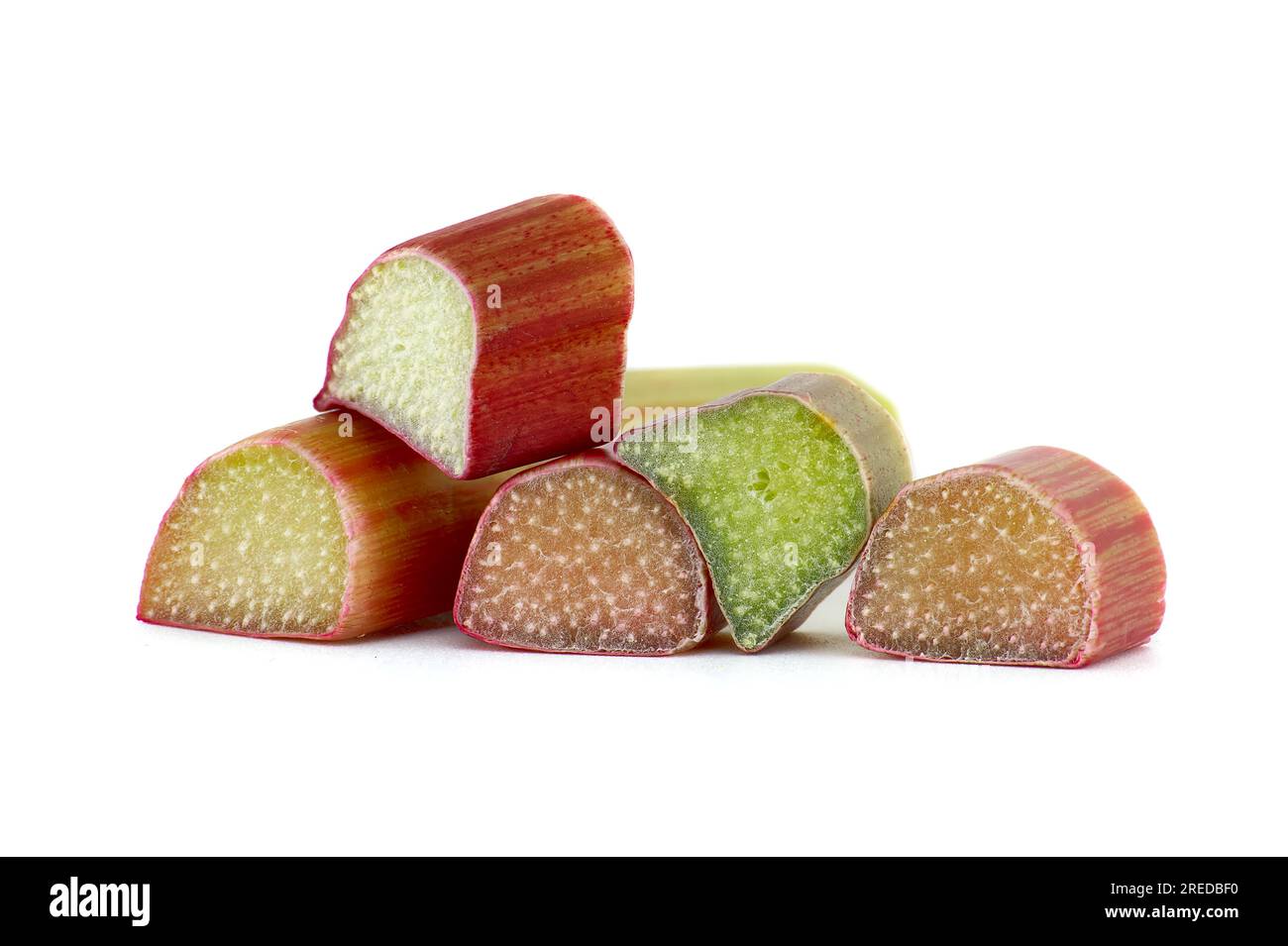 Group of rhubarb pieces in various shapes and sizes arranged in a ...