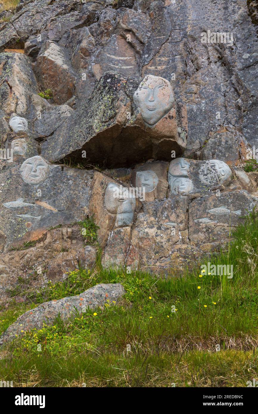Faces, Rock art carvings, part of Stone & Man project by local artist ...