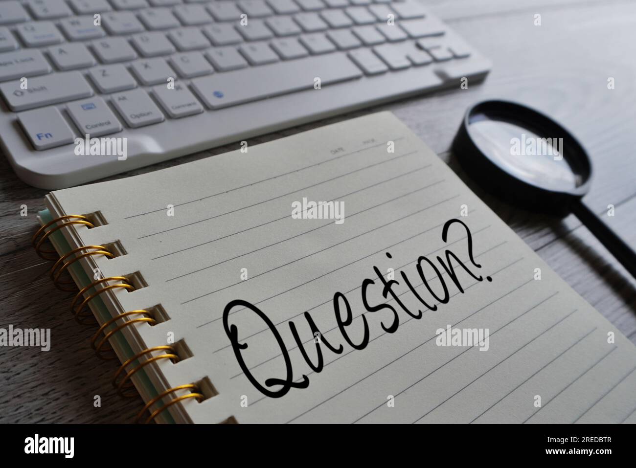 FAQ, Q and A background concept. Close up image of keyboard, magnifying ...