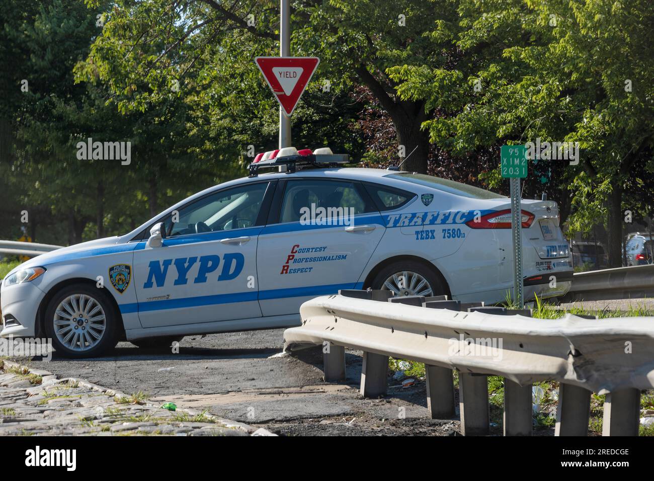 An empty police car sits parked as a deterrant to speeding in the Bronx ...