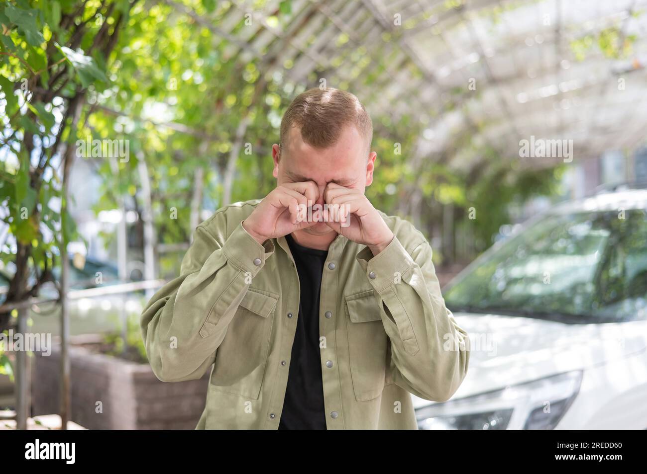 Young caucasian man crying outdoors Stock Photo - Alamy