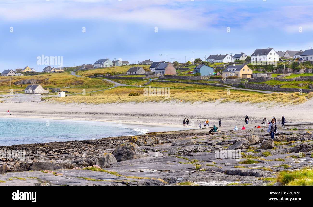 Visiting tourists explore Inisheer, the smallest of the three Aran ...