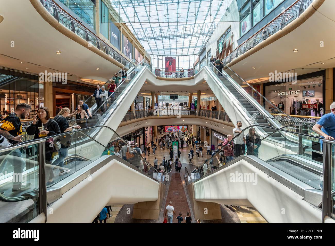 Busy scene with shoppers on escalators inside the Bullring Shopping ...