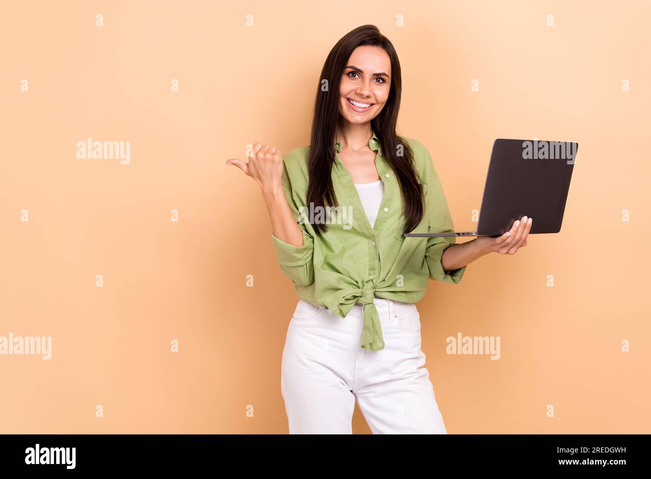 Portrait of nice cheerful girl hold wireless netbook direct thumb ...