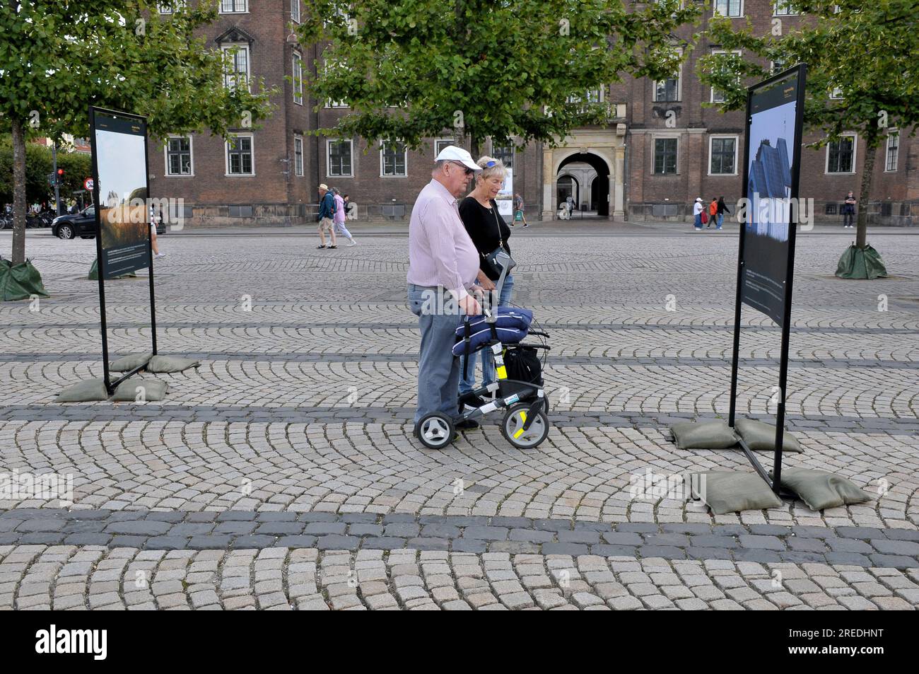 27 July 2023/ Senior citizen couple lookin at photo exhibition in ...