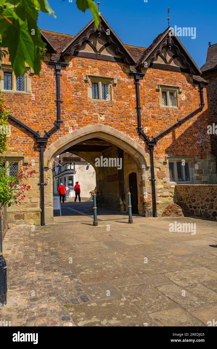The Malvern Museum in a 15th-century brick gatehouse. Next to The Abbey ...