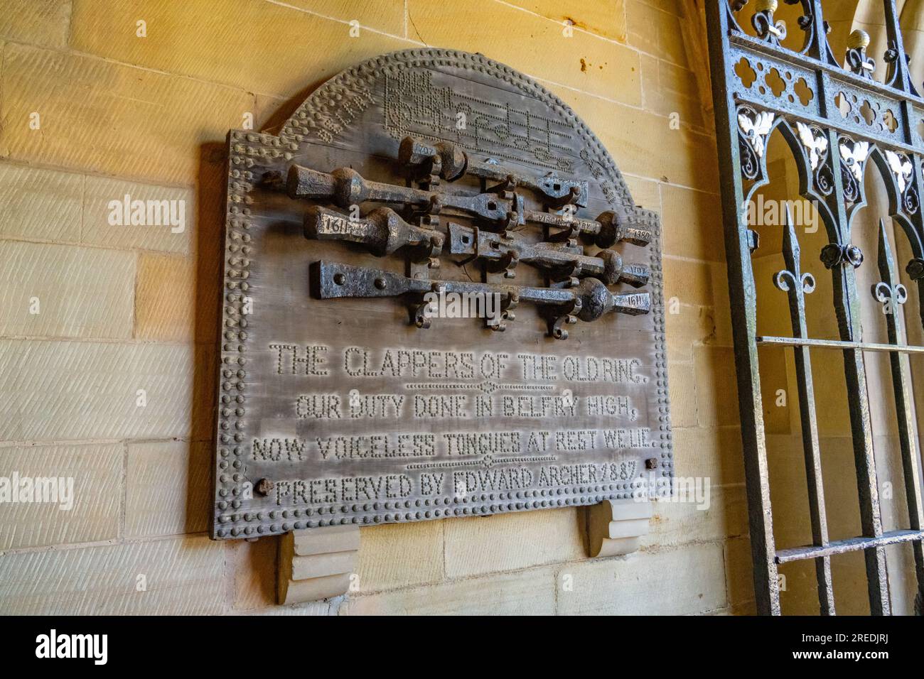 The old bell clappers mounted on the wall of Malvern priory church ...