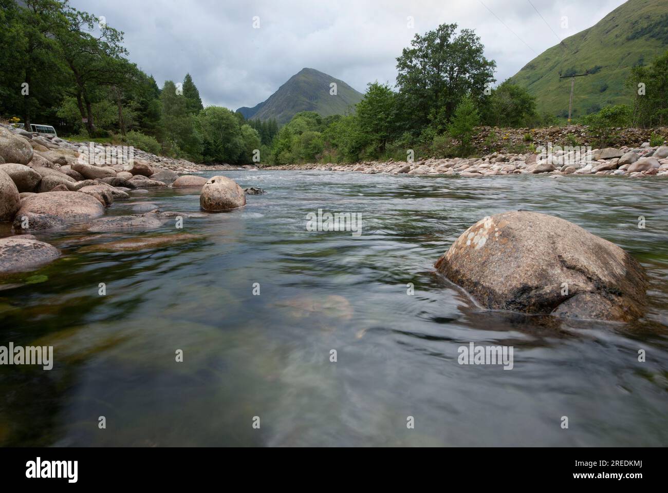 A close up of the blue water and rocks of the River Coe within Glen Coe ...