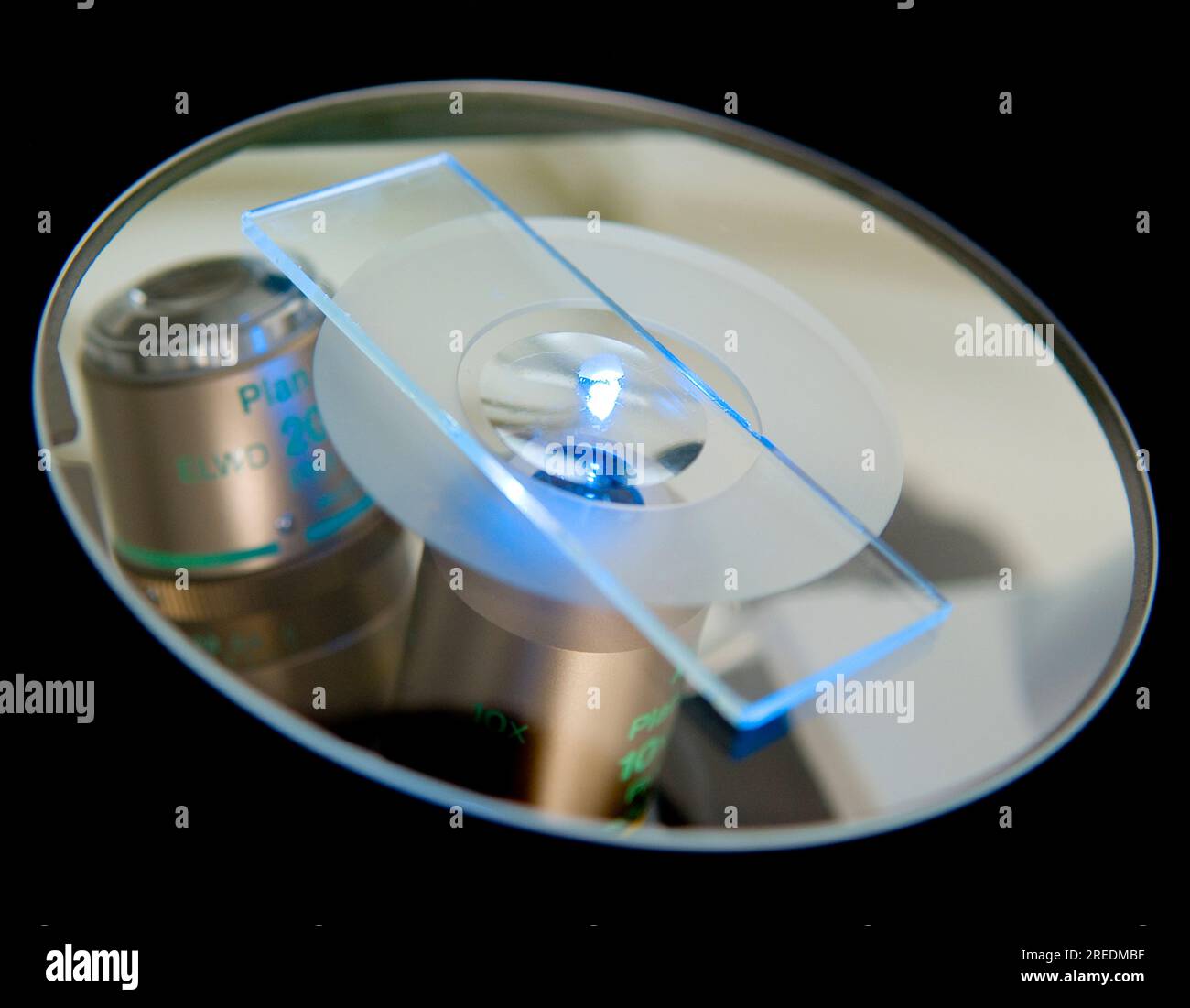 A microscope slide in a clean laboratory with science lab equipment ...