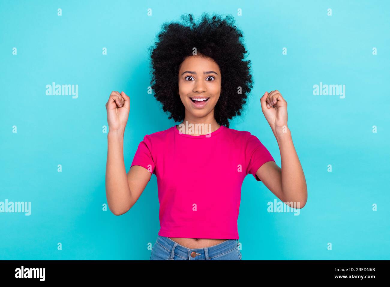 Photo of funky lucky little girl dressed pink t-shirt smiling rising ...