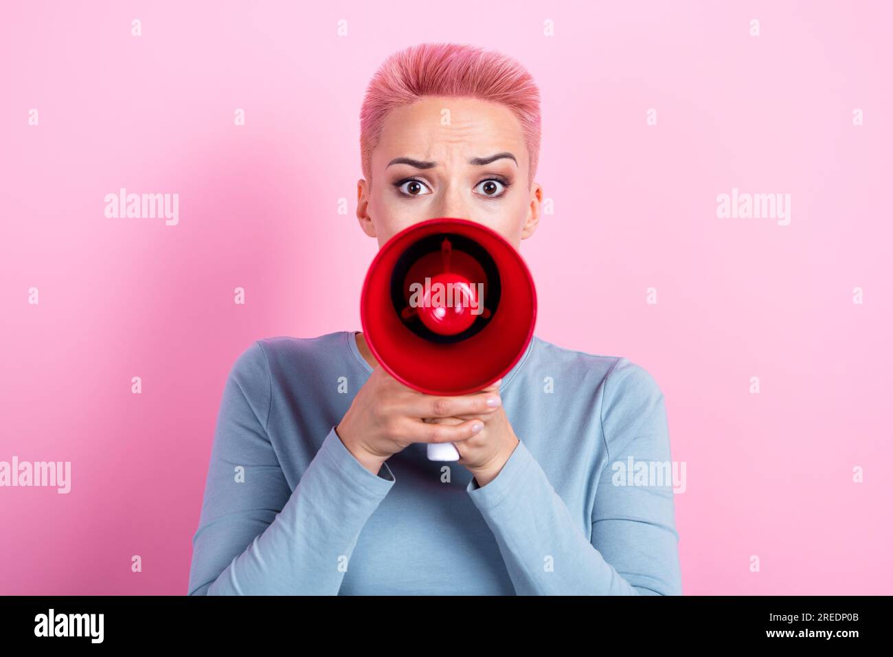 Portrait of astonished woman with dyed hairdo wear stylish clothes ...