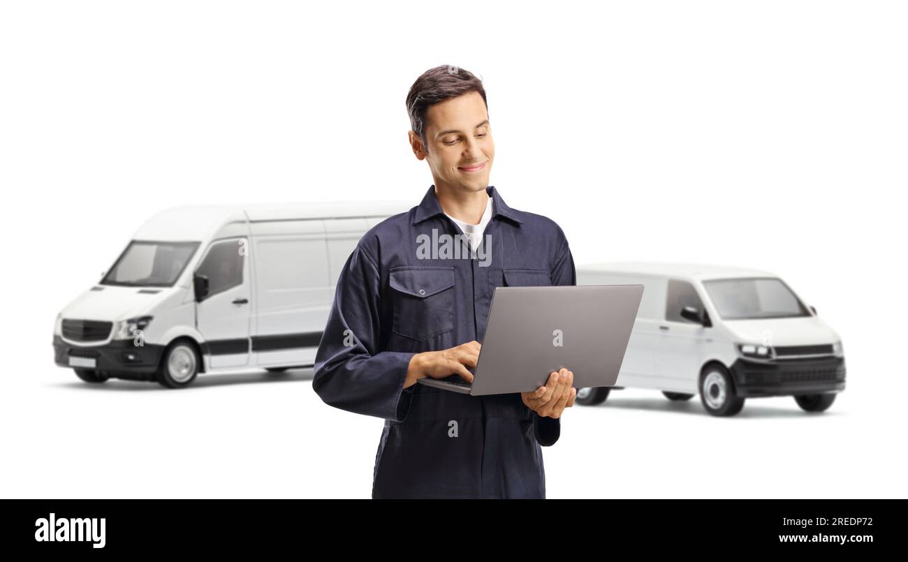 Worker in a uniform with a laptop computer in front of vans isolated on ...