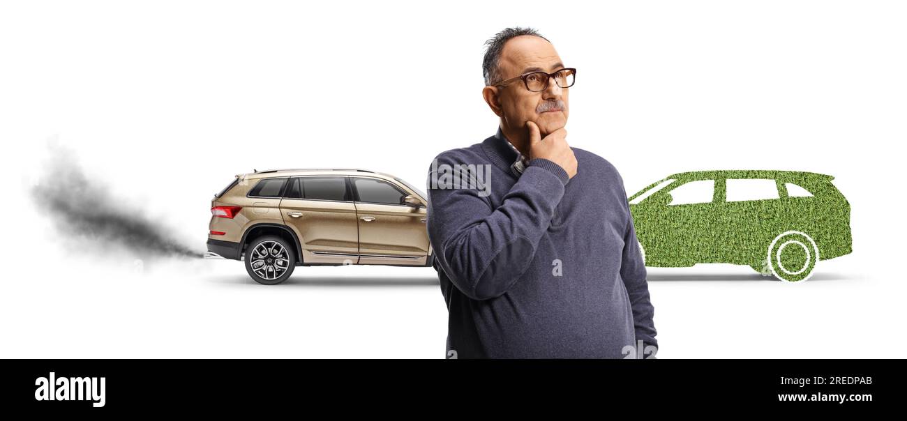 Mature man holding his chin and thinking in front of a green vehicle ...