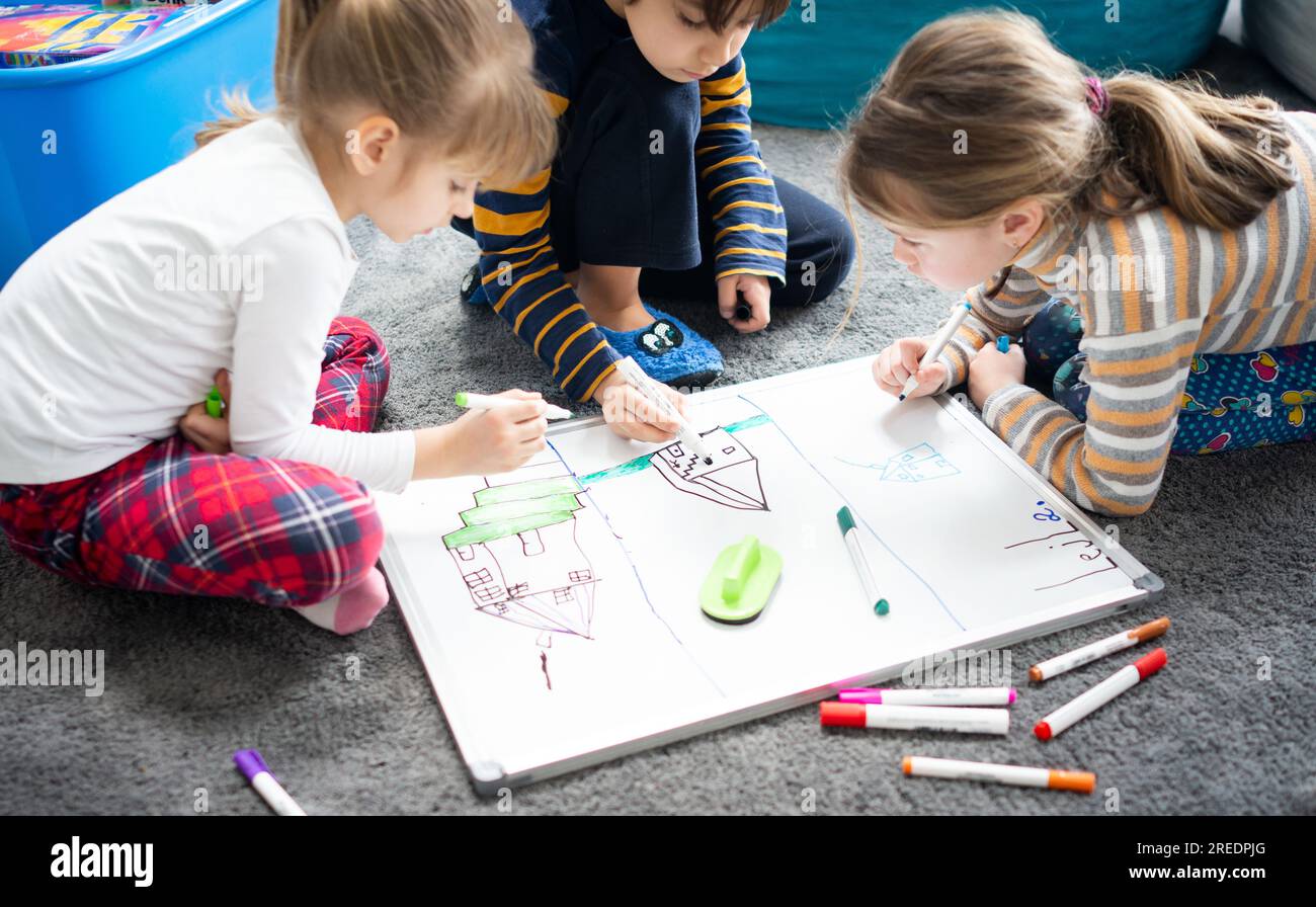 Small group of children having school learning together Stock Photo - Alamy