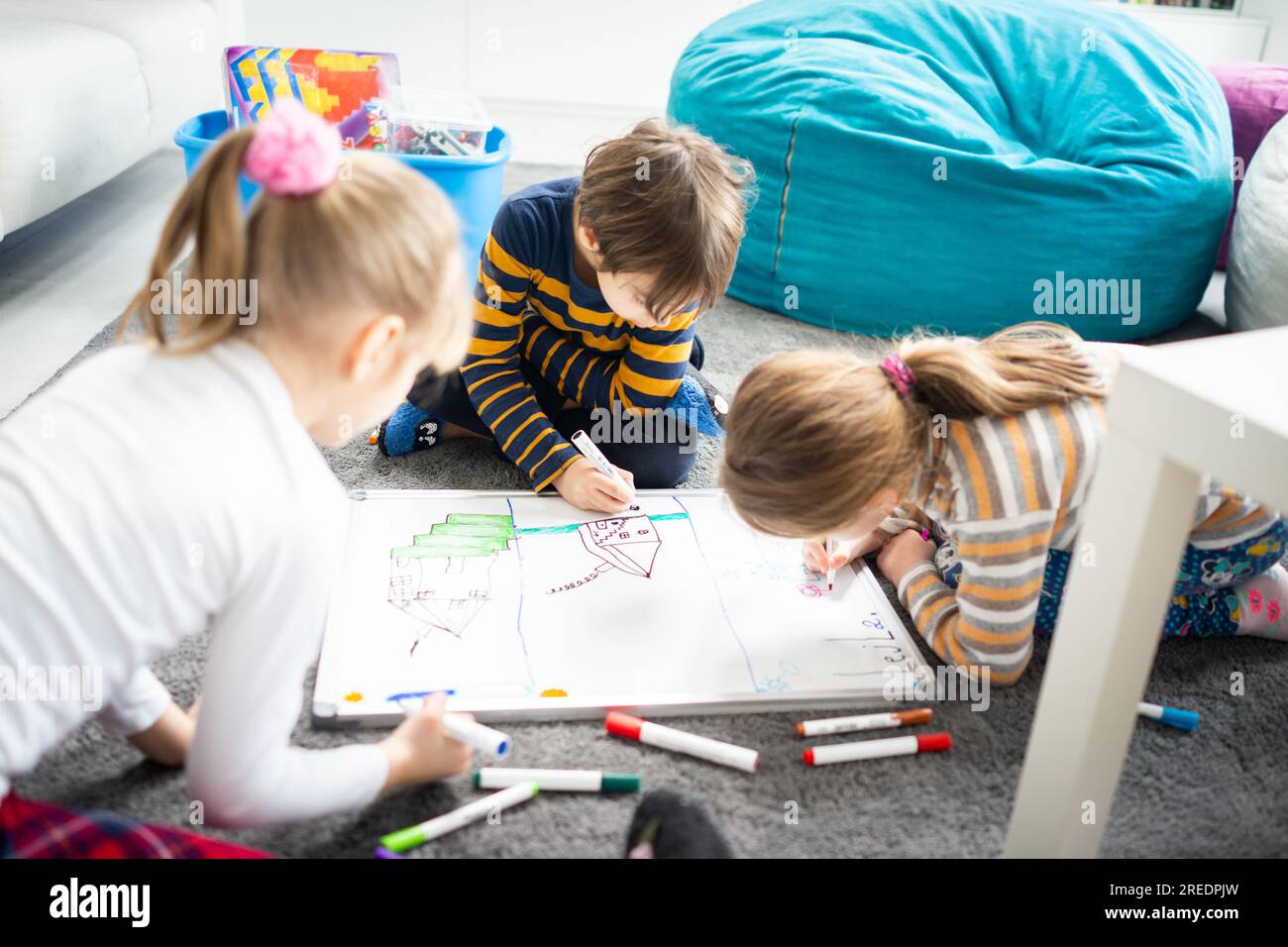 Small group of children having school learning together Stock Photo - Alamy