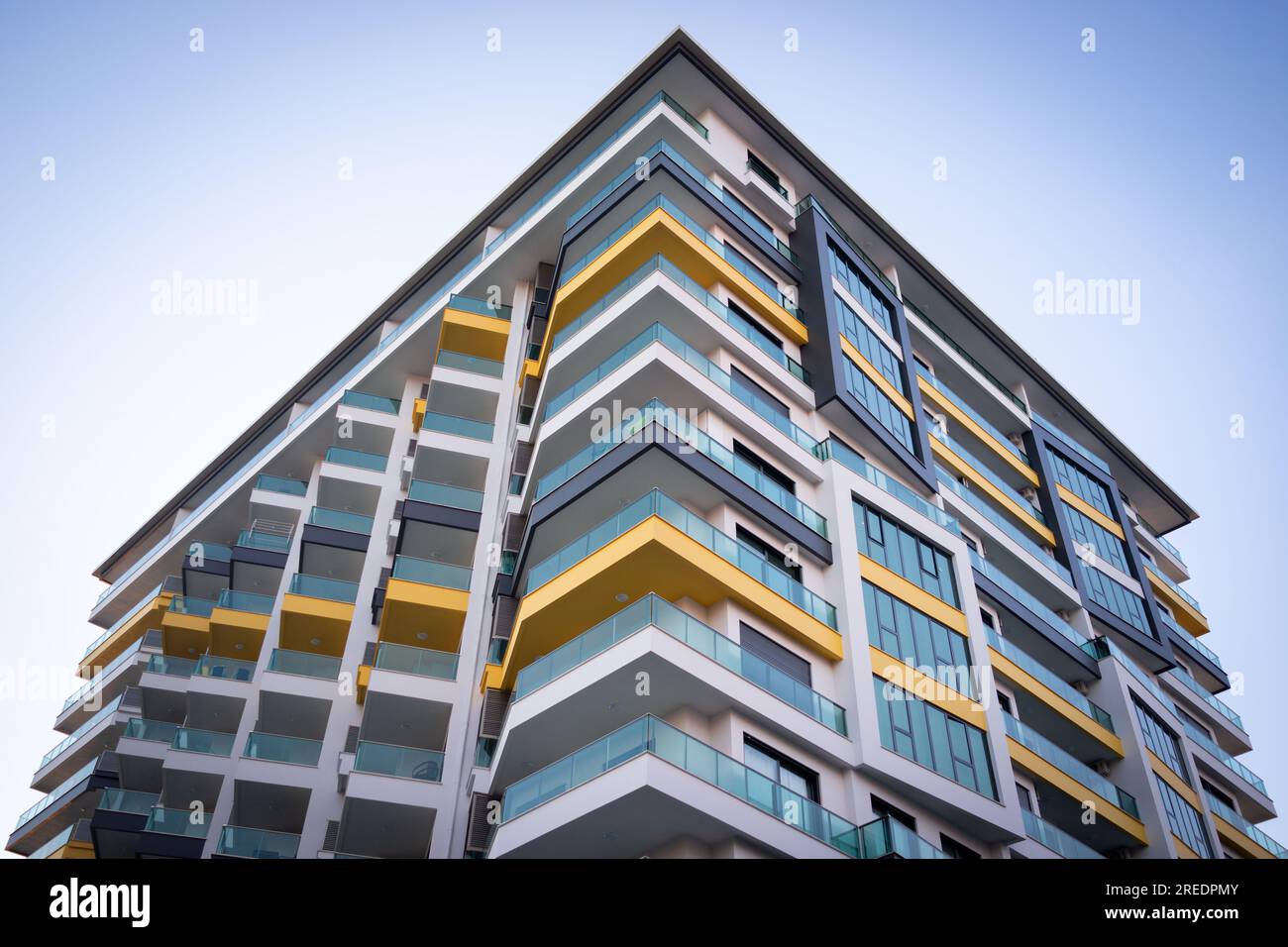 Beautiful living complex with colorful flats on beach Stock Photo - Alamy