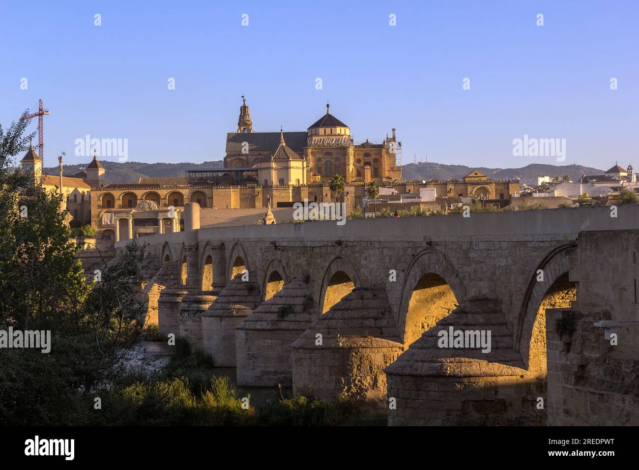 The first sunrays shine through the arches of the ancient roman stone ...