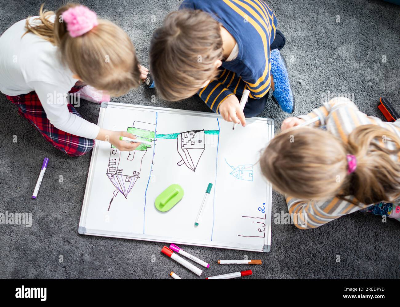 Small group of children having school learning indoors Stock Photo - Alamy