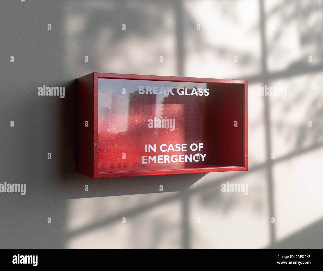 An empty red emergency box with an in case of emergency breakable glass ...