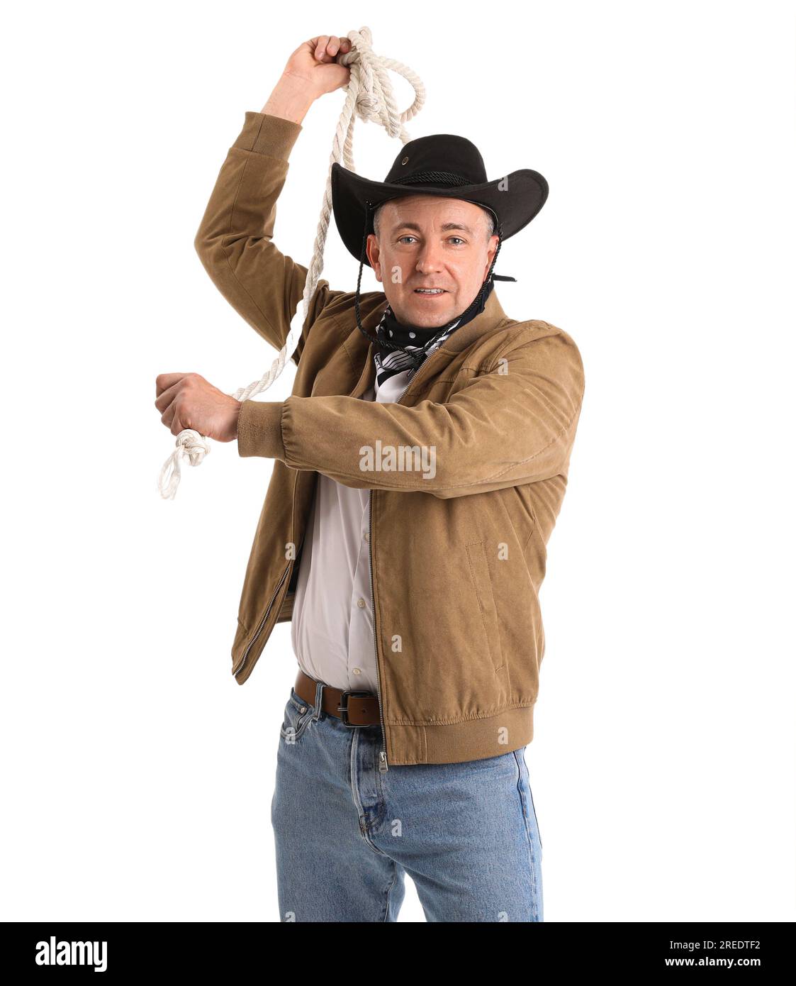 Mature cowboy with lasso on white background Stock Photo - Alamy