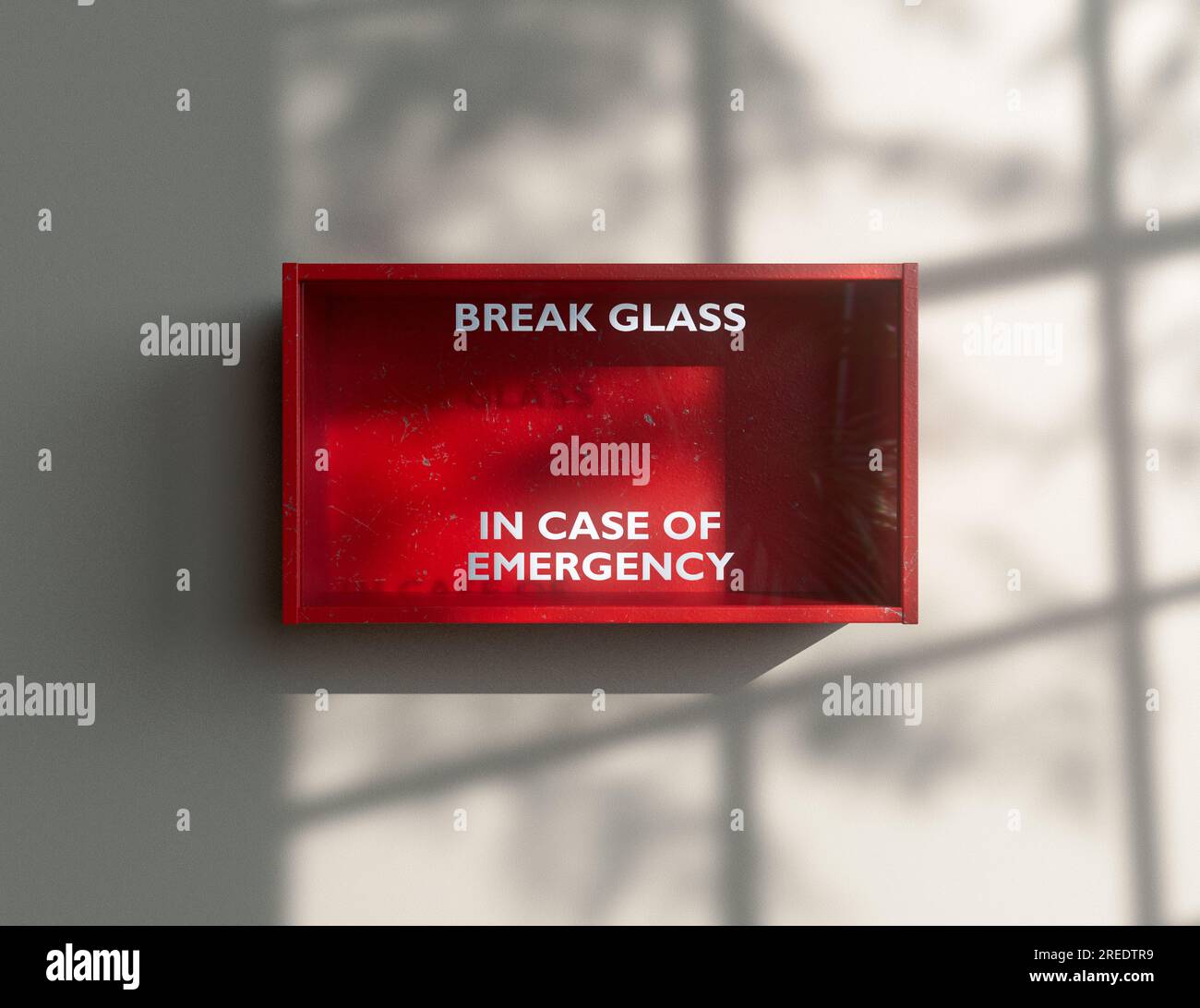 An empty red emergency box with an in case of emergency breakable glass ...