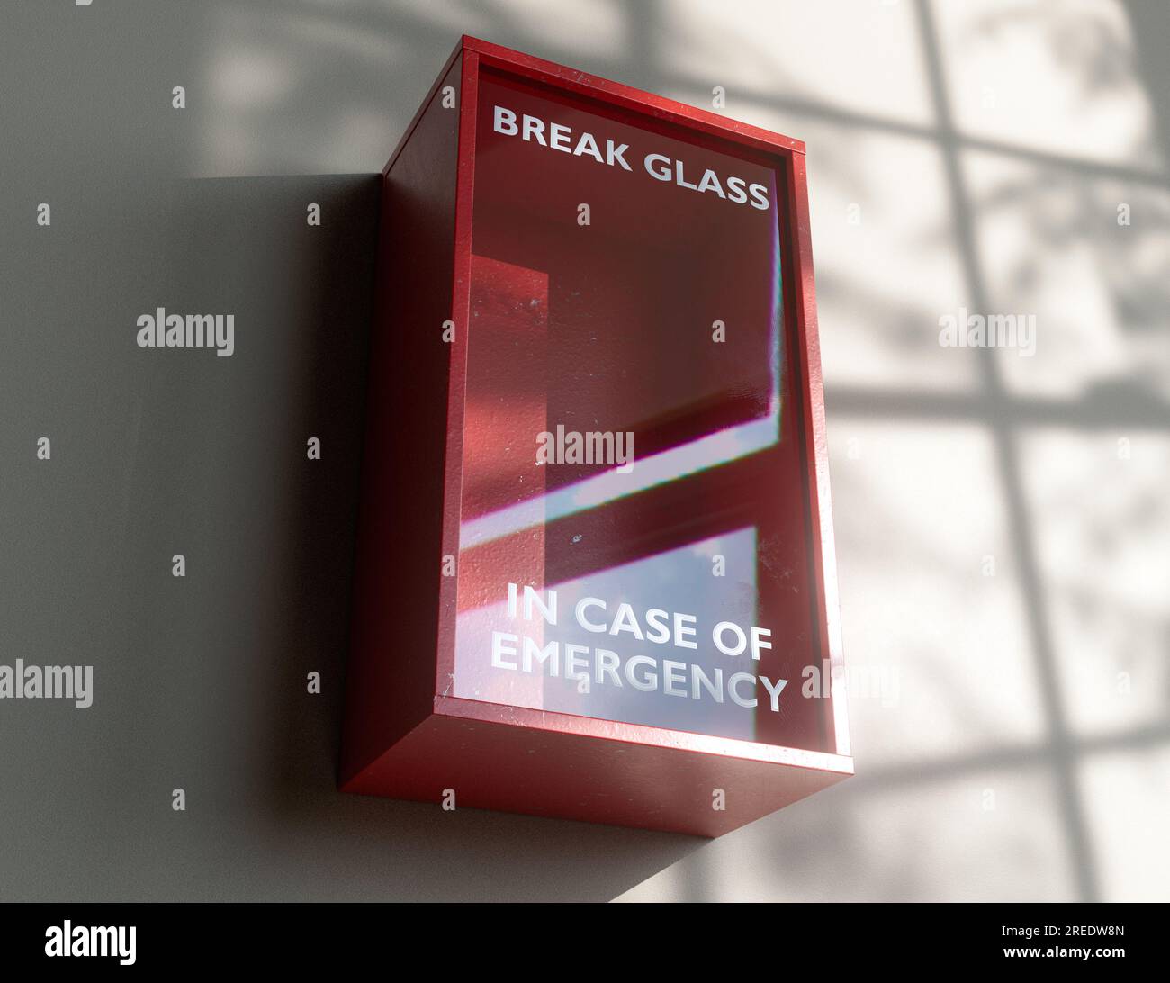 An empty red emergency box with an in case of emergency breakable glass ...