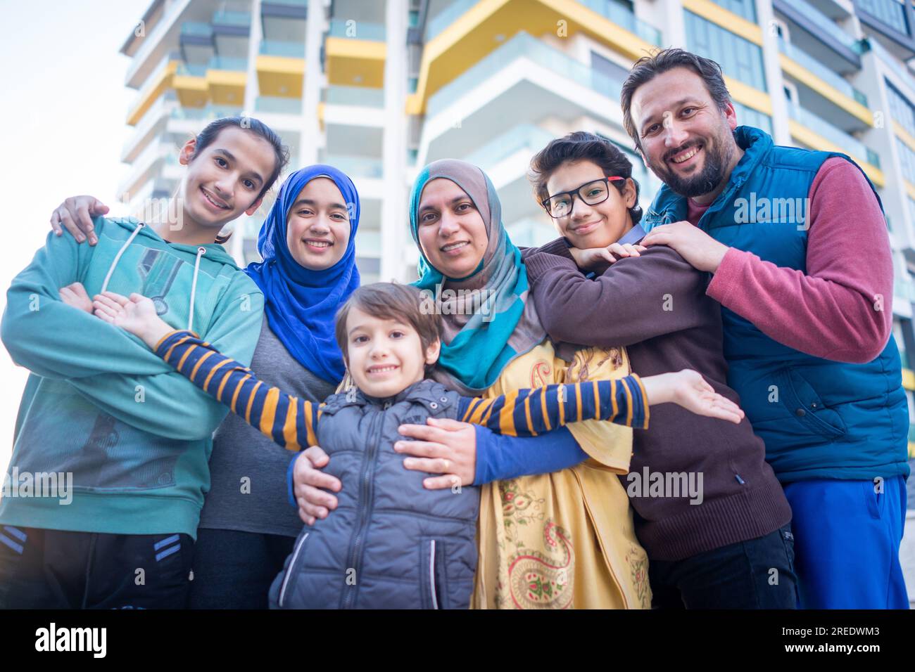 Real Muslim family on city street together Stock Photo - Alamy