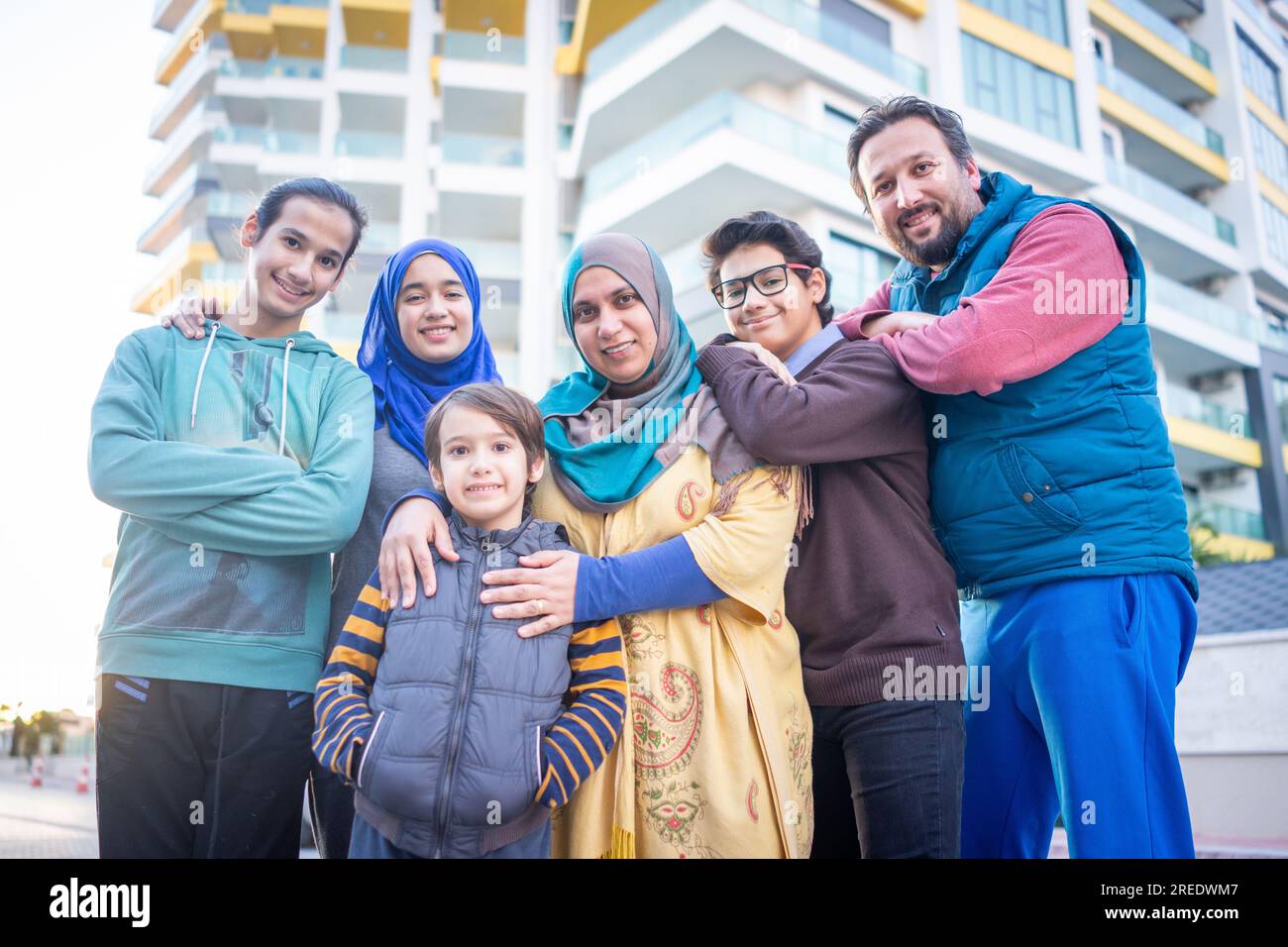 Real Muslim family on city street together Stock Photo - Alamy