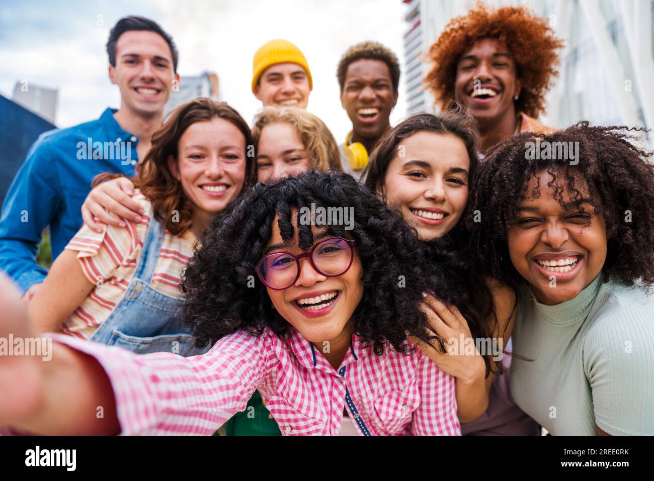 Happy Playful Multiethnic Group Of Young Friends Bonding Outdoors