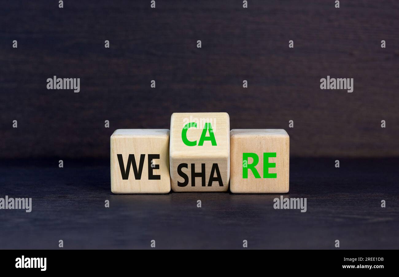 We share and care symbol. Concept word we share we care on wooden block ...