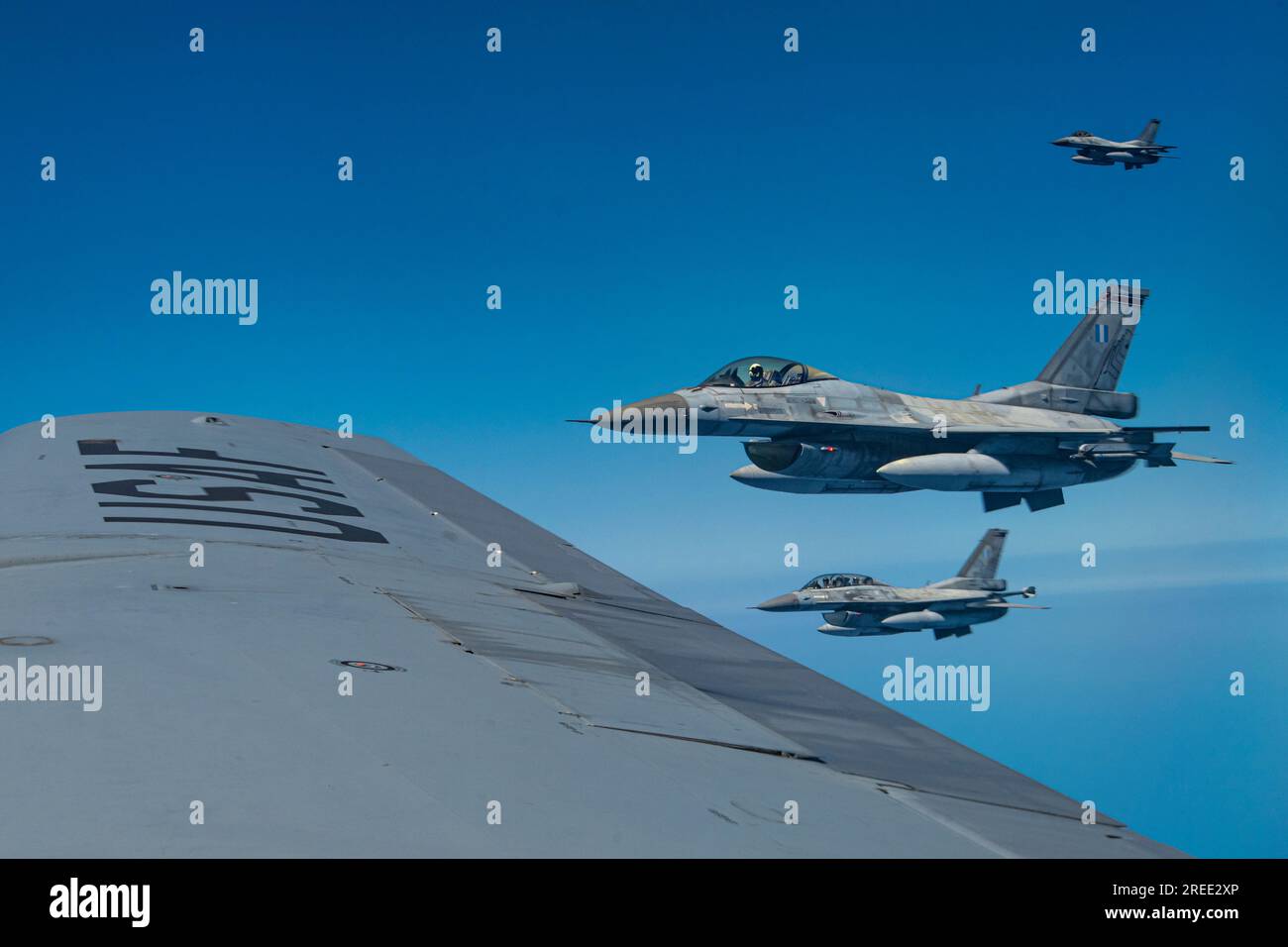 A KC-135 Stratotanker and F-16 Fighting Falcon fly over Greece on June ...