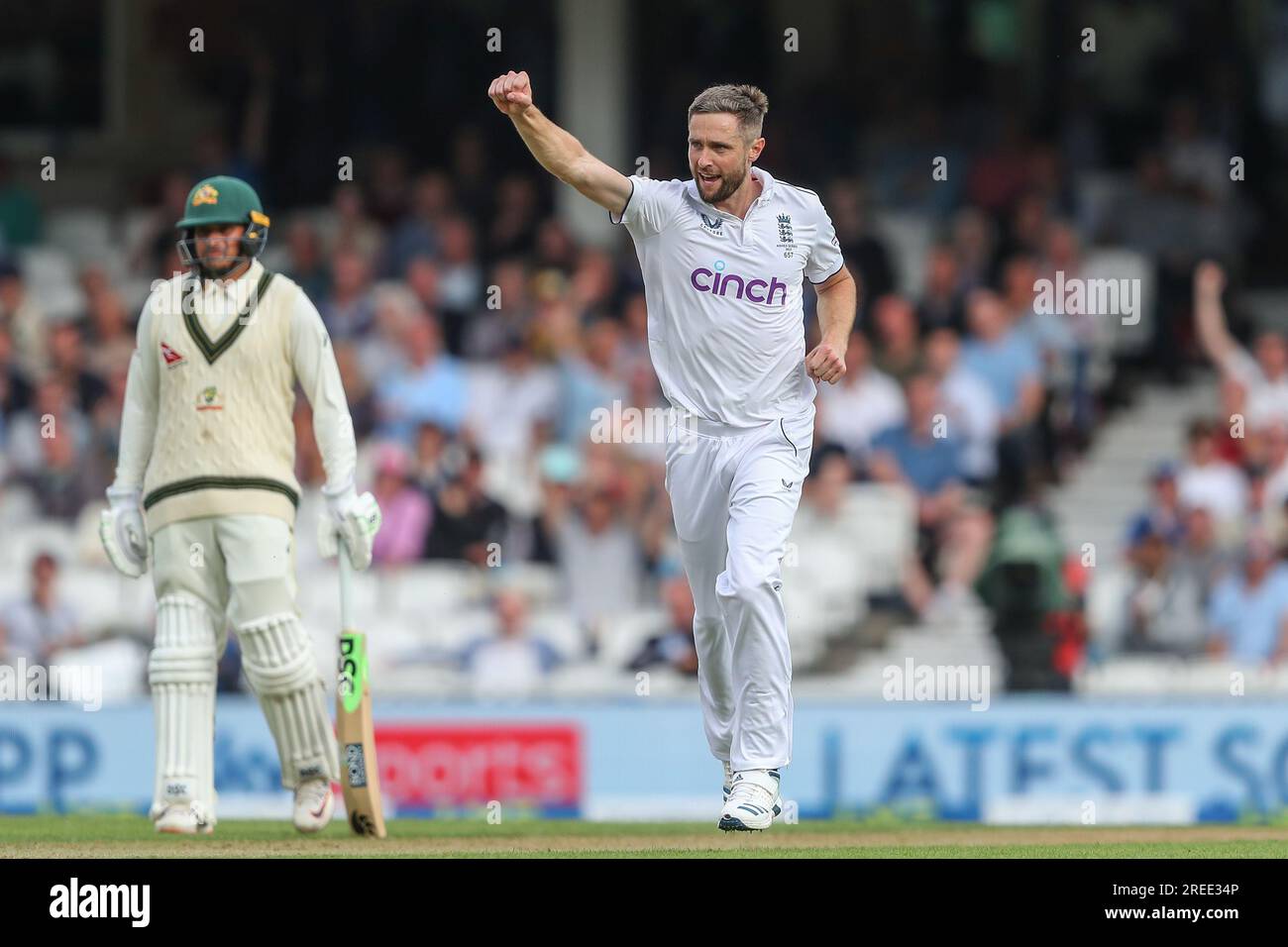 Chris Woakes of England celebrates the dismissal of David Warner of ...